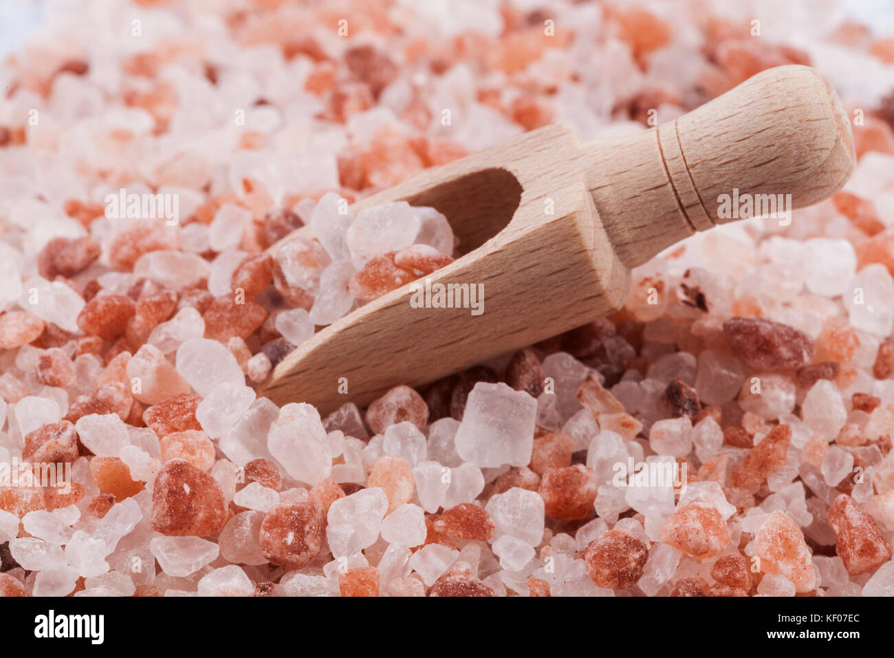 Himalayan Salt Raw Crystals Pile with Brown Wood Spice Scoop Isolated ...