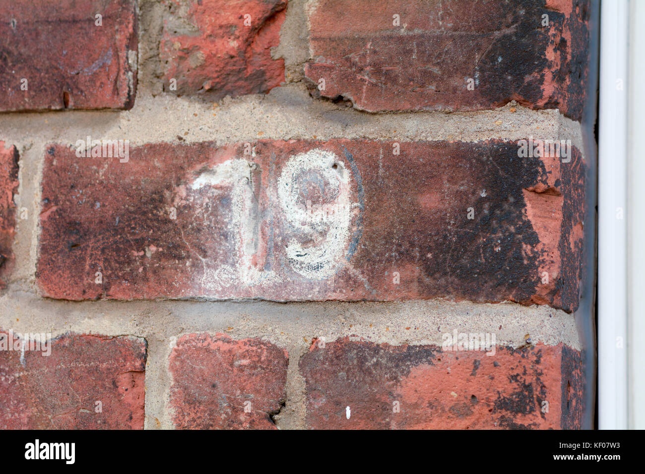 House number 19 sign painted on wall Stock Photo - Alamy