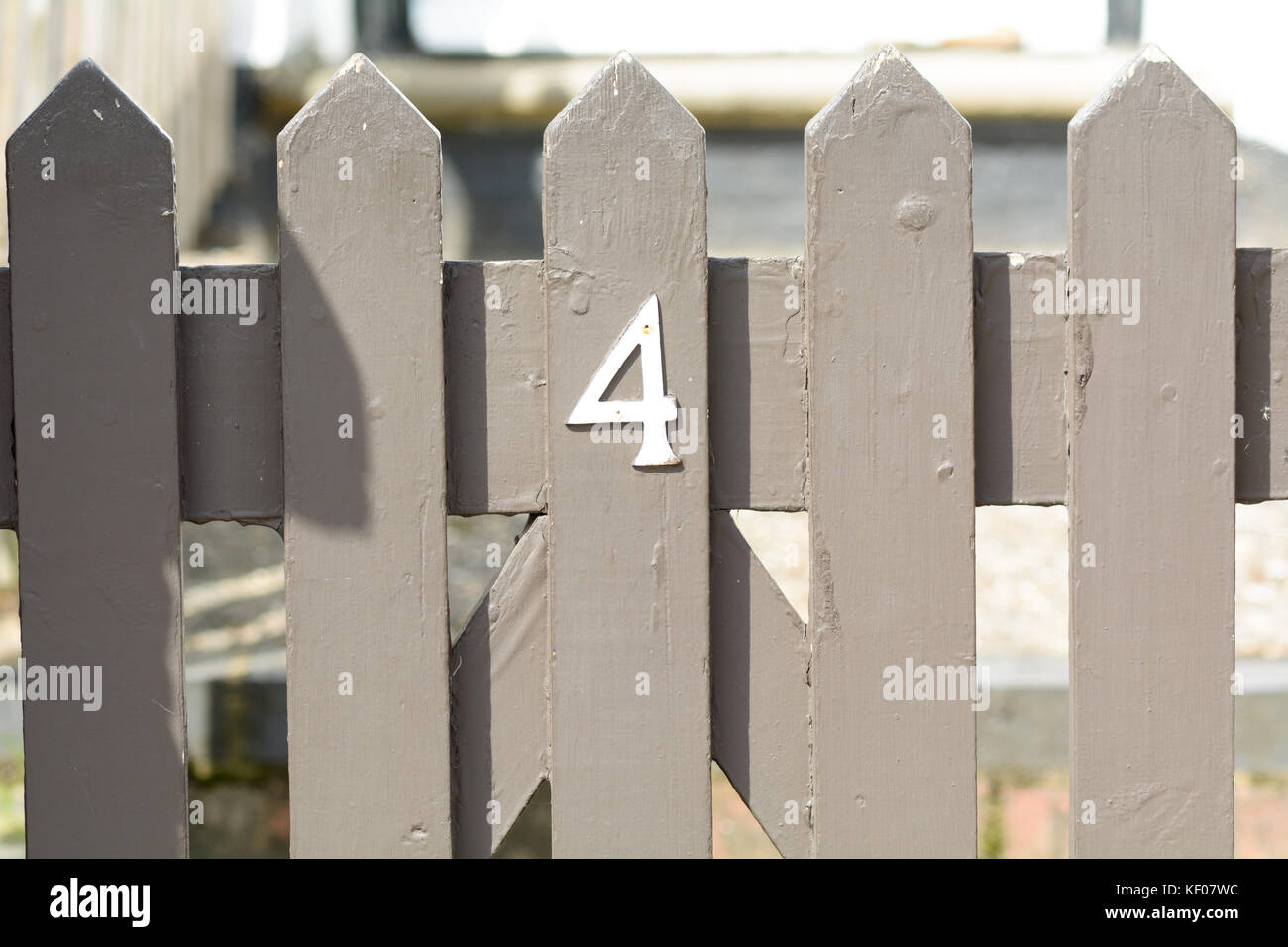 House number 4 sign on wooden gate Stock Photo - Alamy