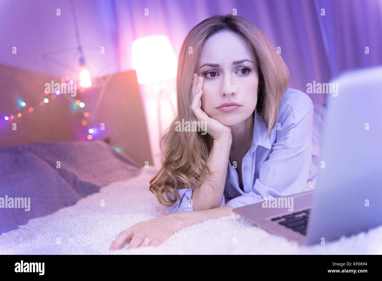 Sad woman waiting for news Stock Photo - Alamy