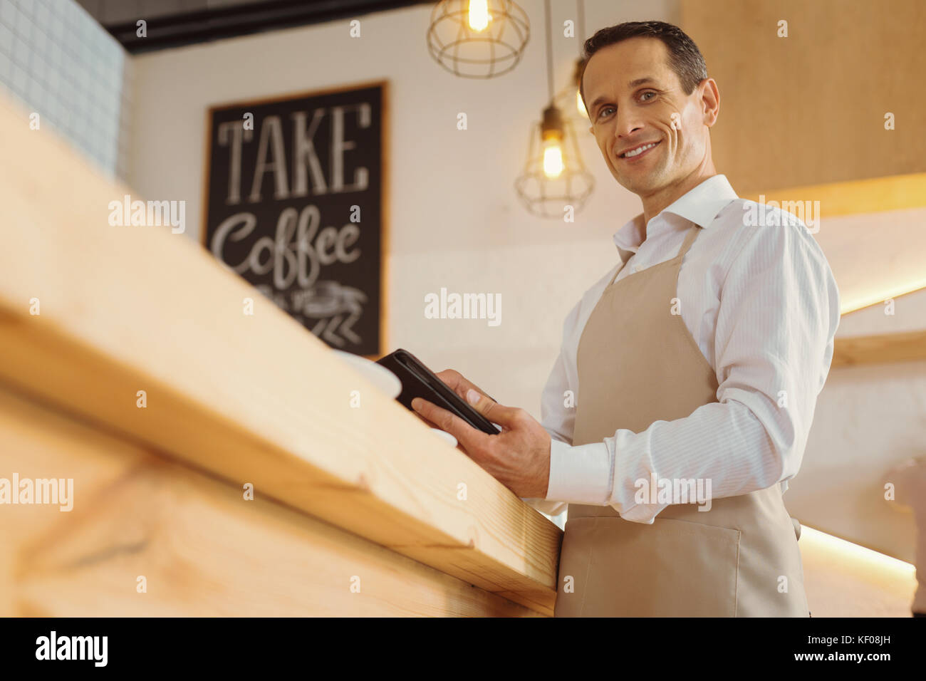Happy delighted man looking at you Stock Photo - Alamy