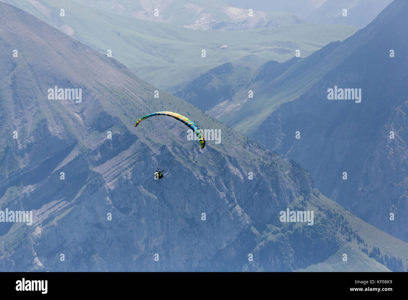 one paraglider in Bernese Alps within natural mountains Stock Photo - Alamy