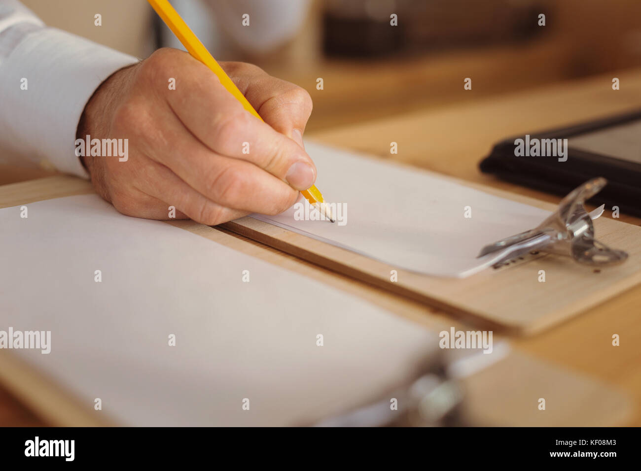 Close up of pencil being used for writing Stock Photo - Alamy