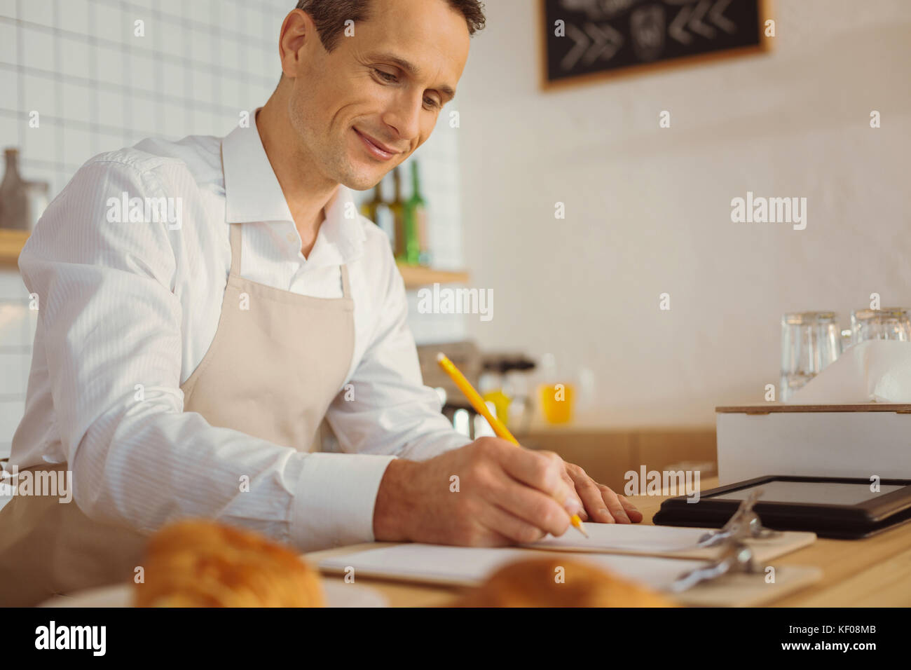 Cheerful smart man being involved in his work Stock Photo - Alamy