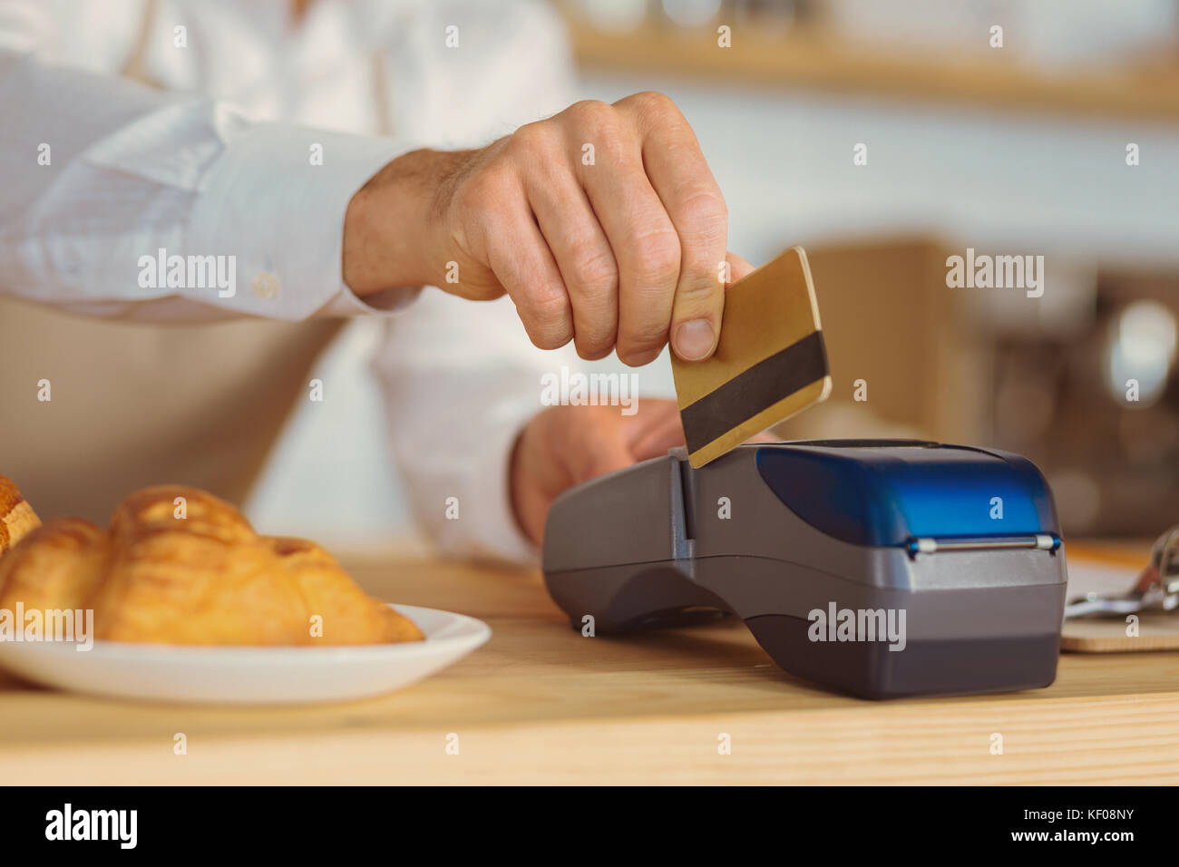 Close up of a credit card being used for payment Stock Photo - Alamy