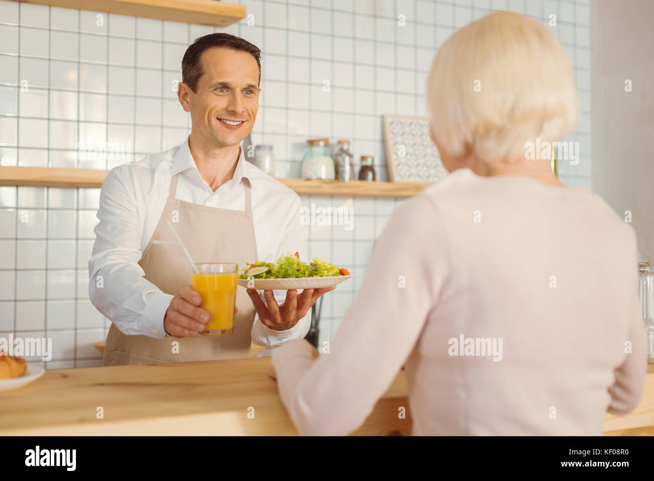 Customer interaction at counter hi-res stock photography and images - Alamy