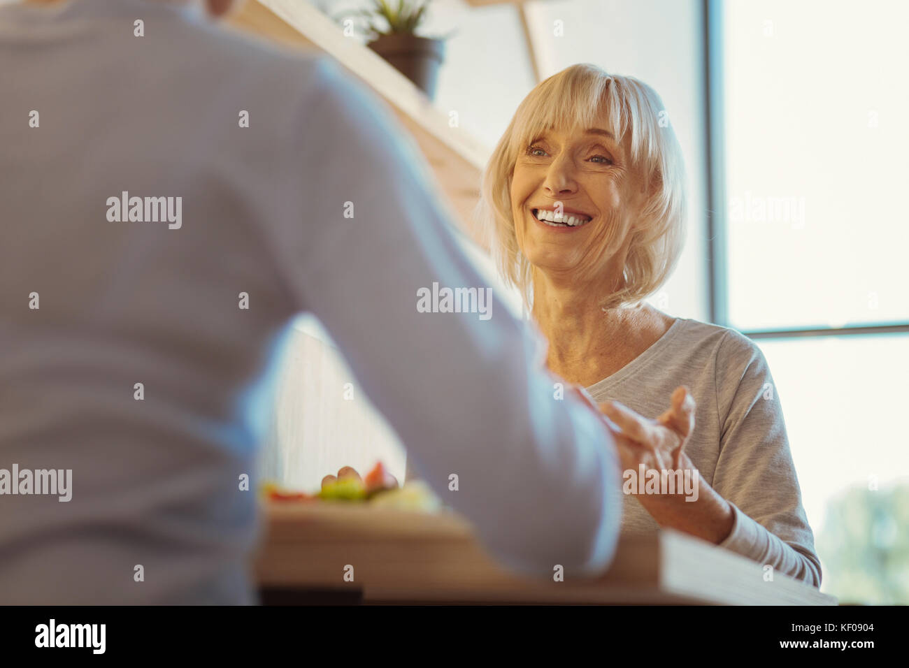Cheerful positive woman feeling happy Stock Photo - Alamy