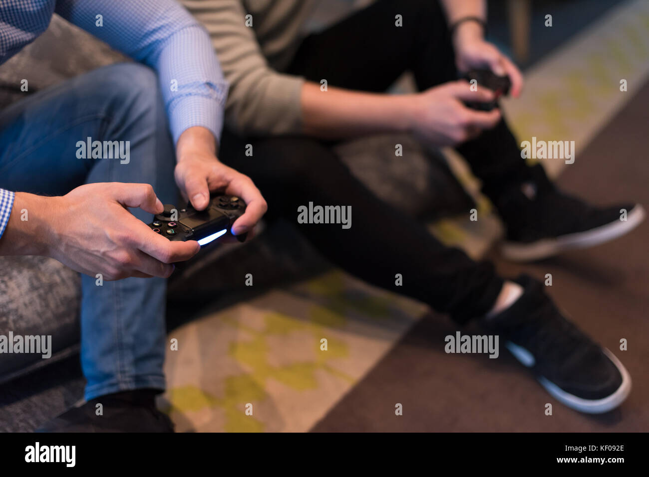 Work hard play hard. Workers Playing computer games in creative startup ...