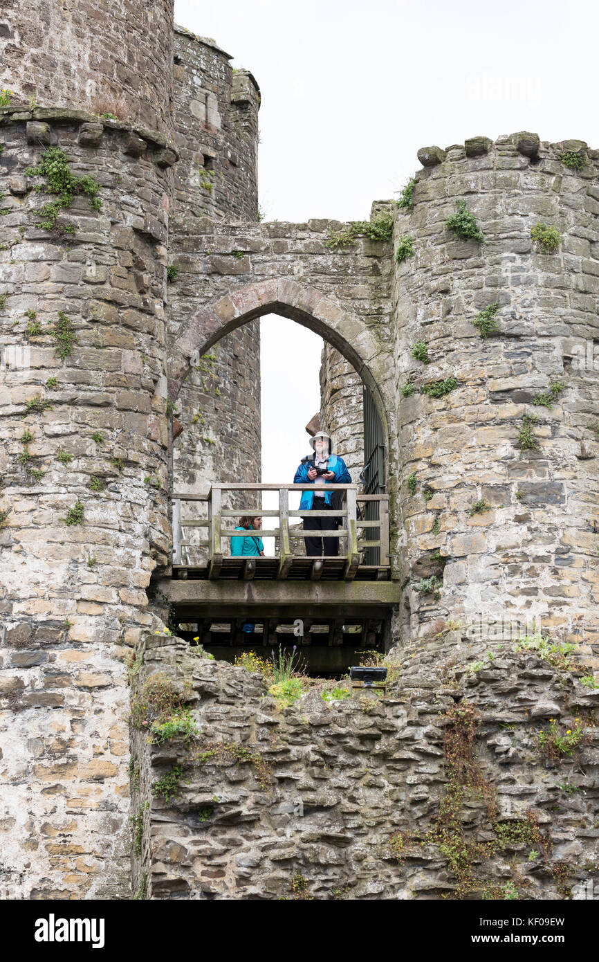 tourist looking out from archway, Conwy castle North Wales Stock Photo ...