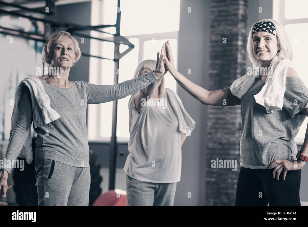 Fitness high five senior hi-res stock photography and images - Alamy