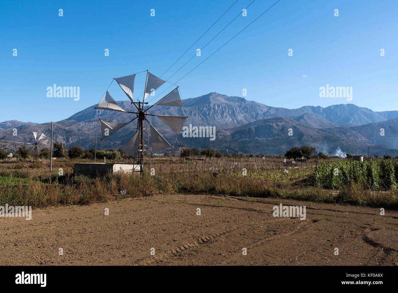 Windmill and mountains on the Lasithi plateau Crete, Greece. October ...