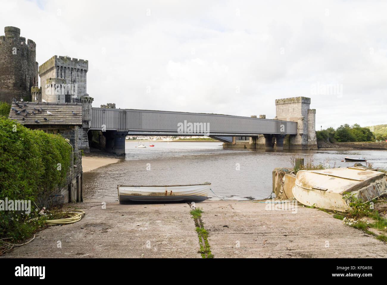 Conwy railway bridge view from river slipway Stock Photo - Alamy
