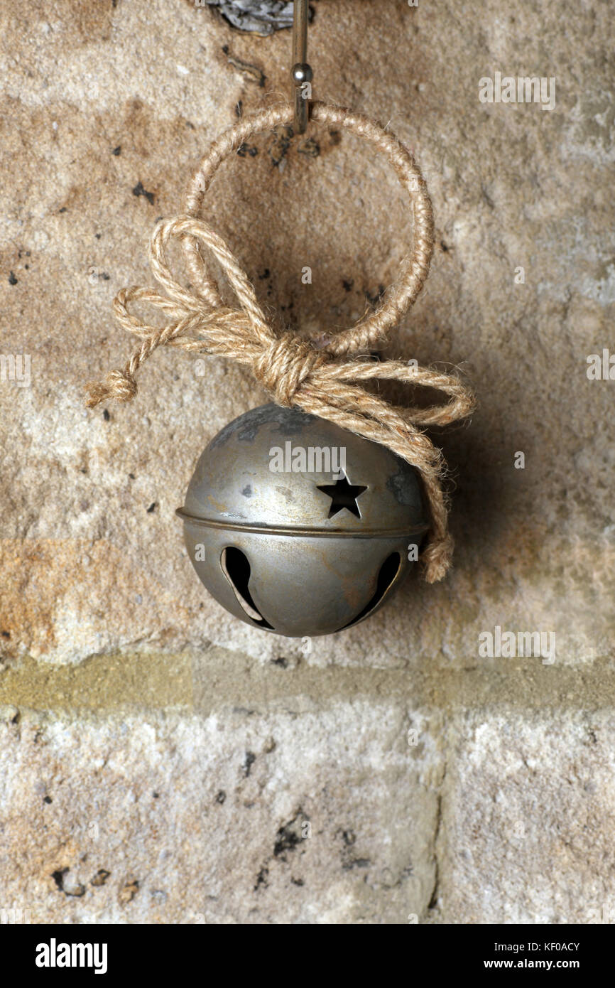 Beautiful rustic metal bauble hanging against my stone fireplace Stock ...