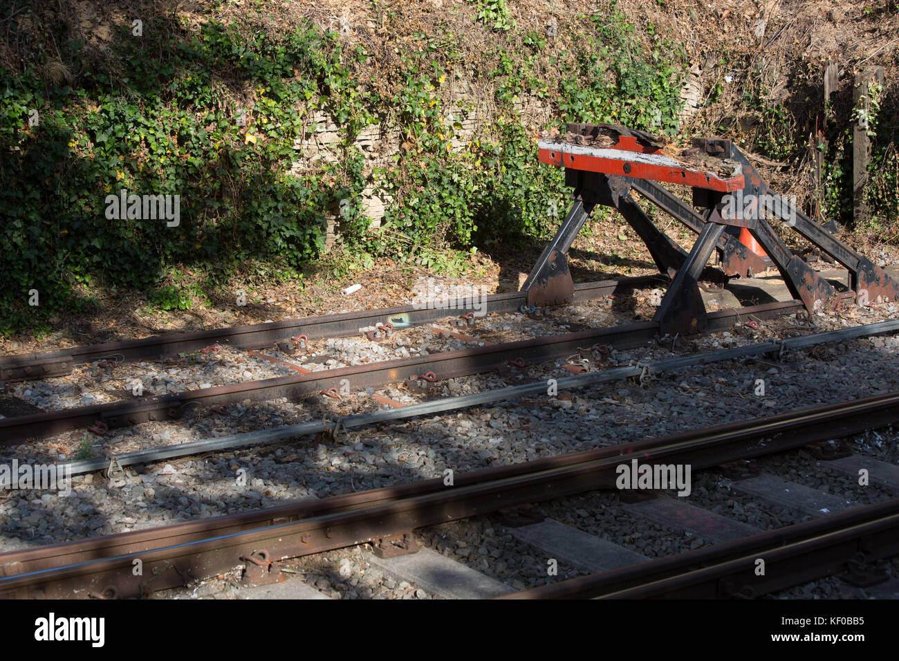 In the distasnce a railway line or track disappears through a tunnel in ...