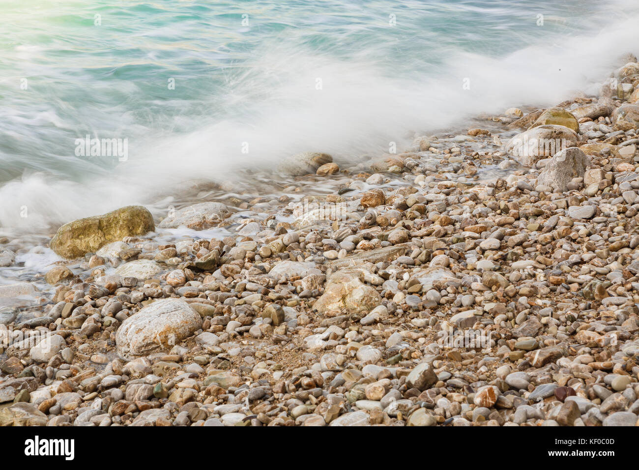 waves break against the rocks Stock Photo - Alamy