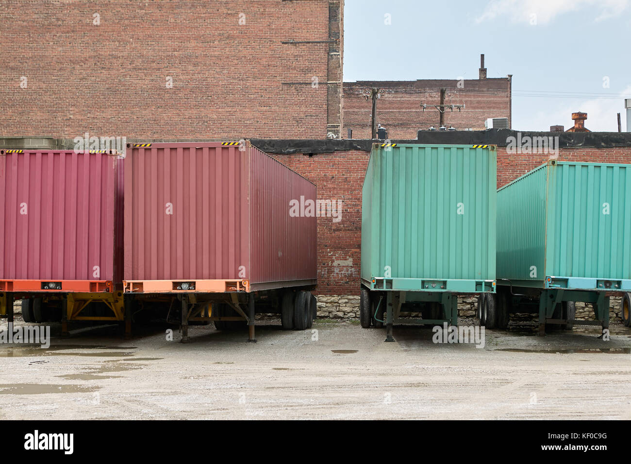 Various heavy haulage truck transport trailers parked in line at a ...