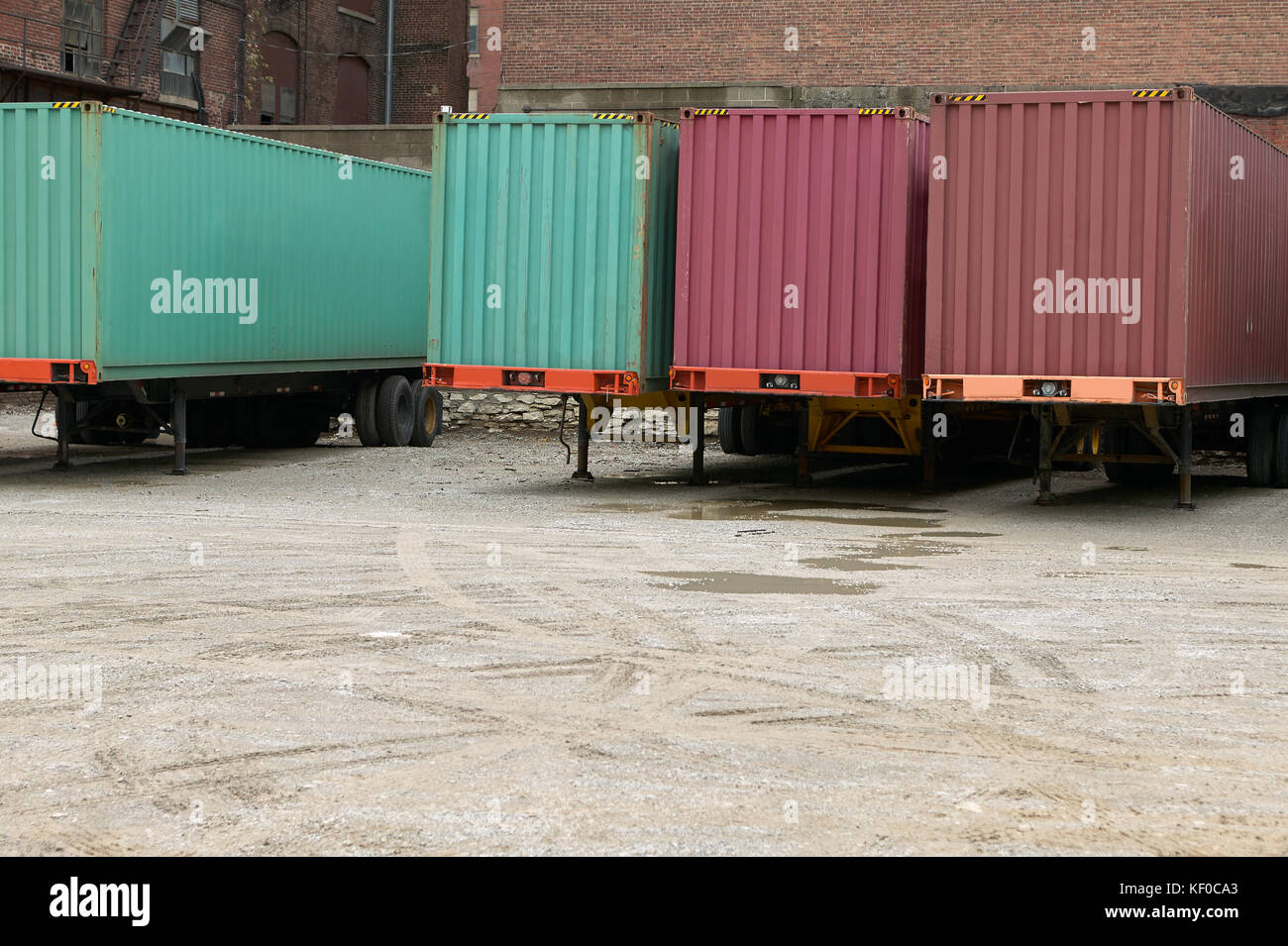 Various heavy haulage truck transport trailers parked in line at a ...