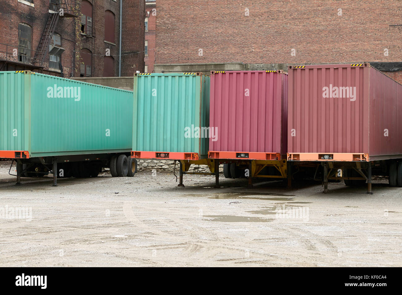 Various heavy haulage truck transport trailers parked in line at a ...