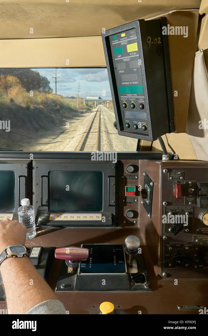Inside view of the drivers cabin of a moving train with several panels ...