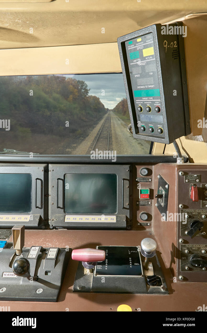 Interior view of the drivers cab inside train with a large window with ...