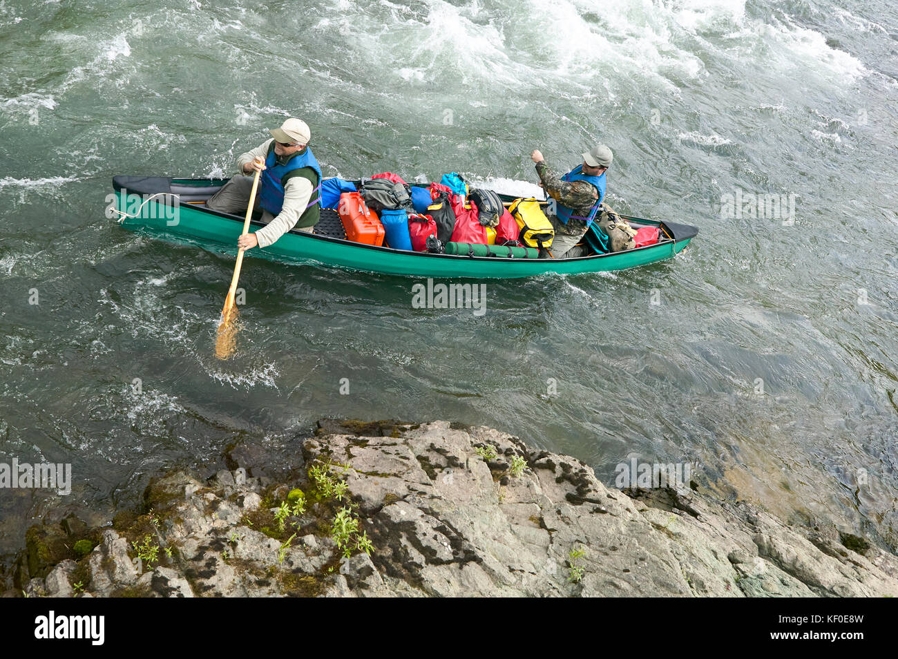 Two men on river rocks two men on river rocks hi-res stock photography ...