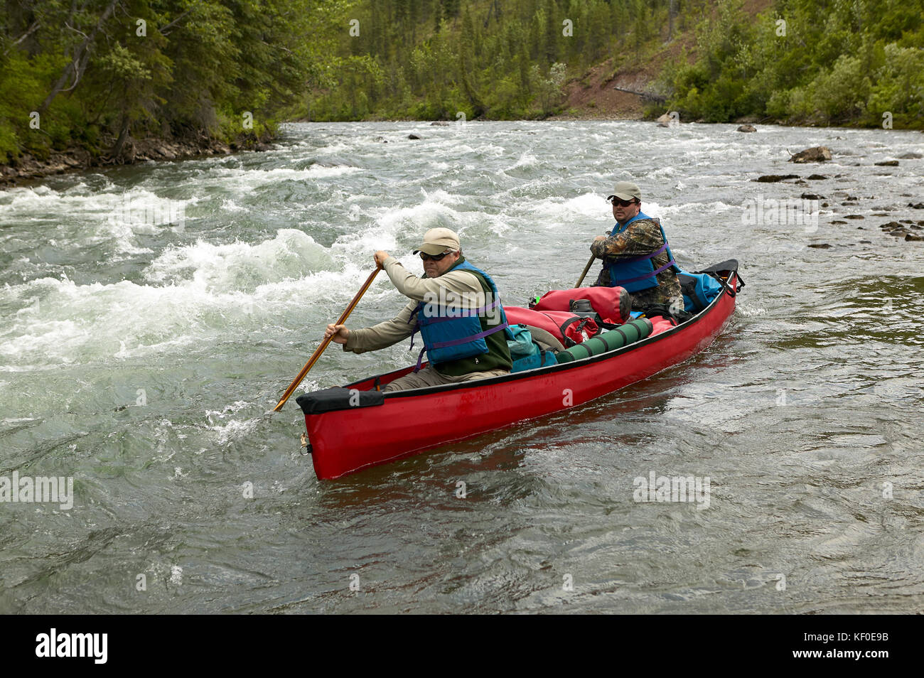 Two men navigate canoe hi-res stock photography and images - Alamy