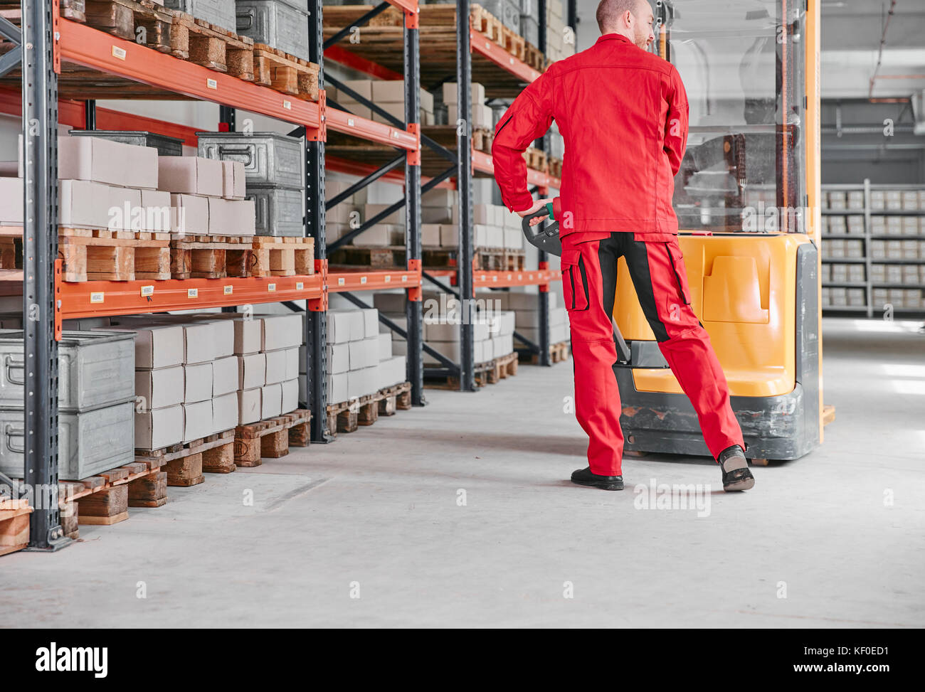 Man in factory using forklift Stock Photo - Alamy