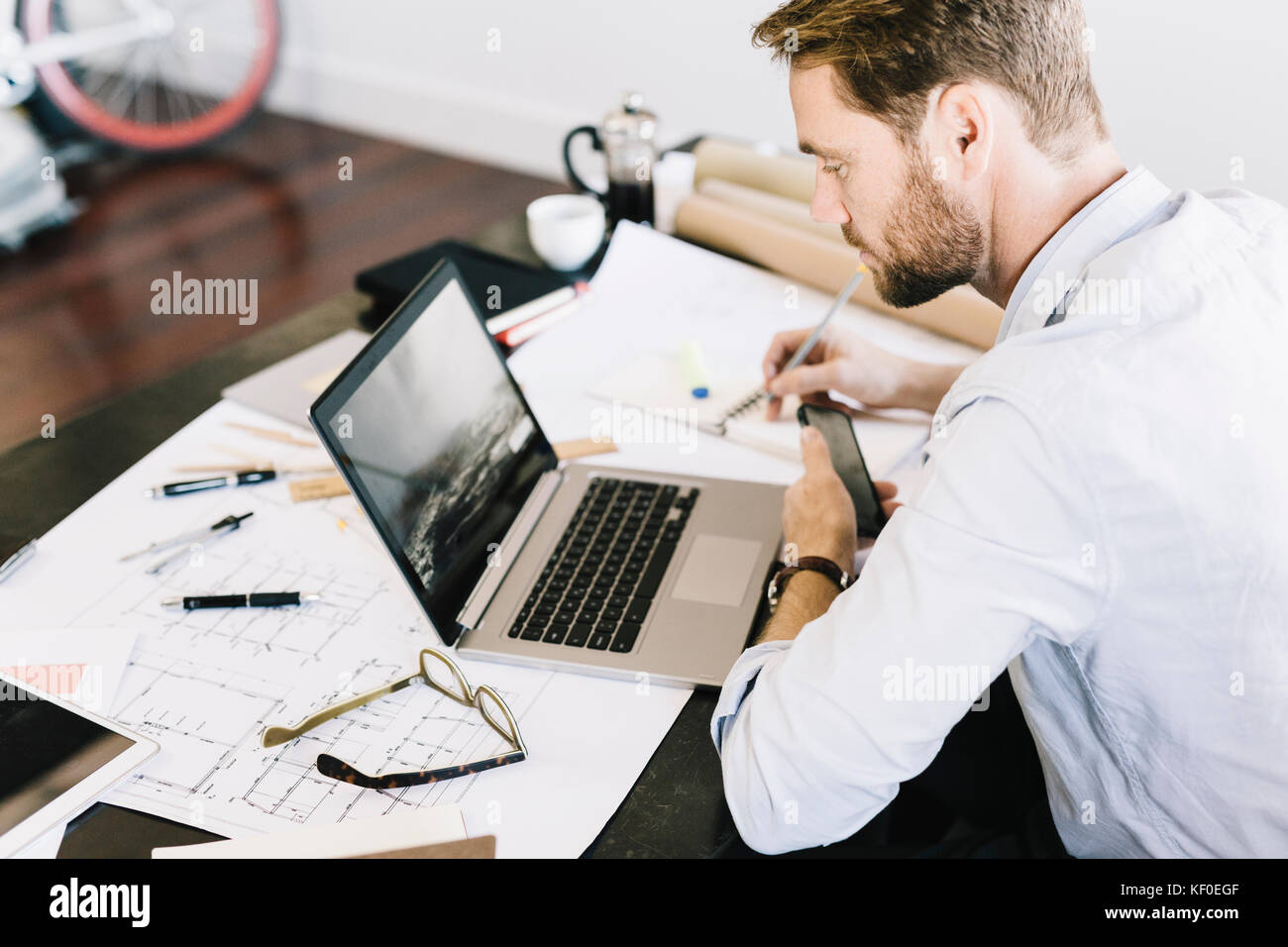 Architect working on laptop in his office Stock Photo - Alamy
