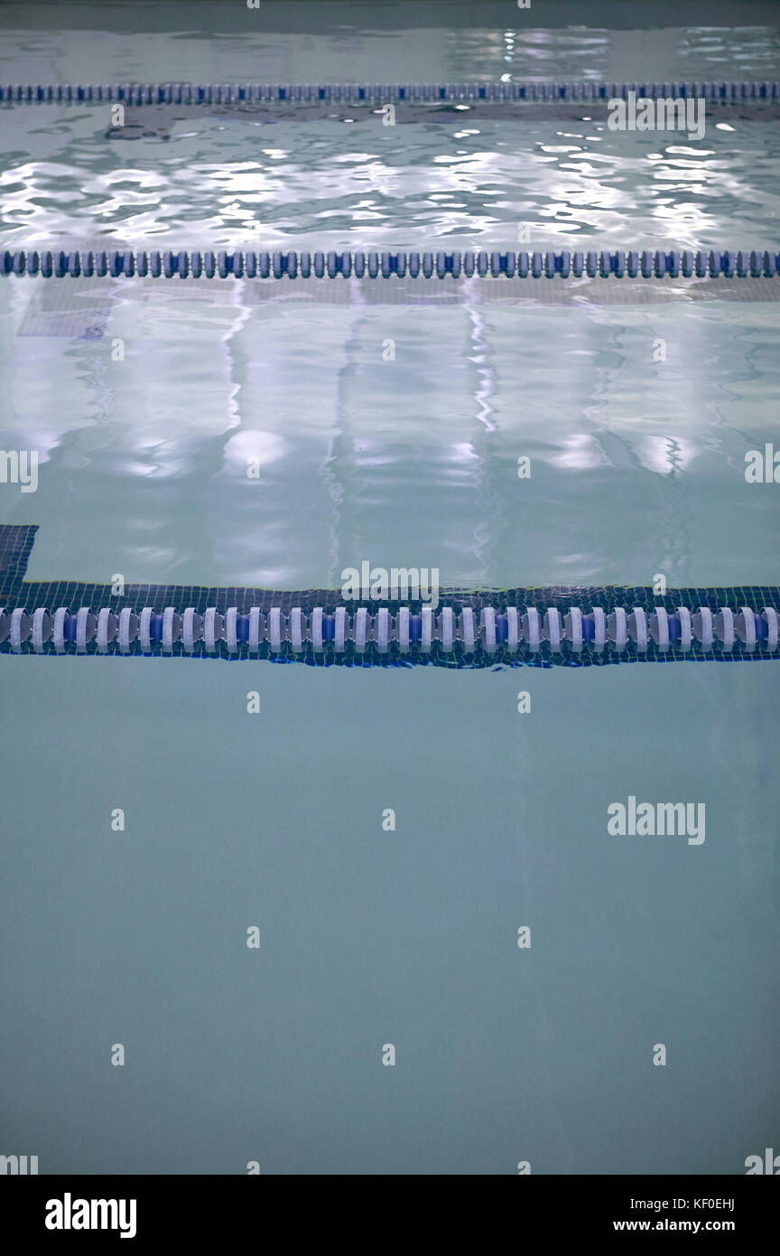 Lanes in a competition swimming pool with sparkling water viewed ...