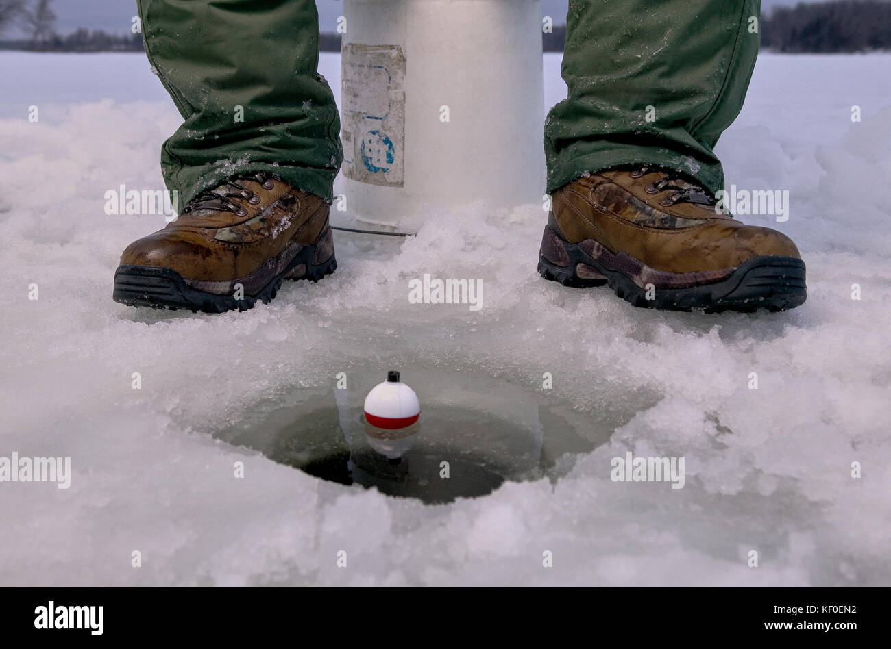 Man sitting on bucket fishing hi-res stock photography and images - Alamy