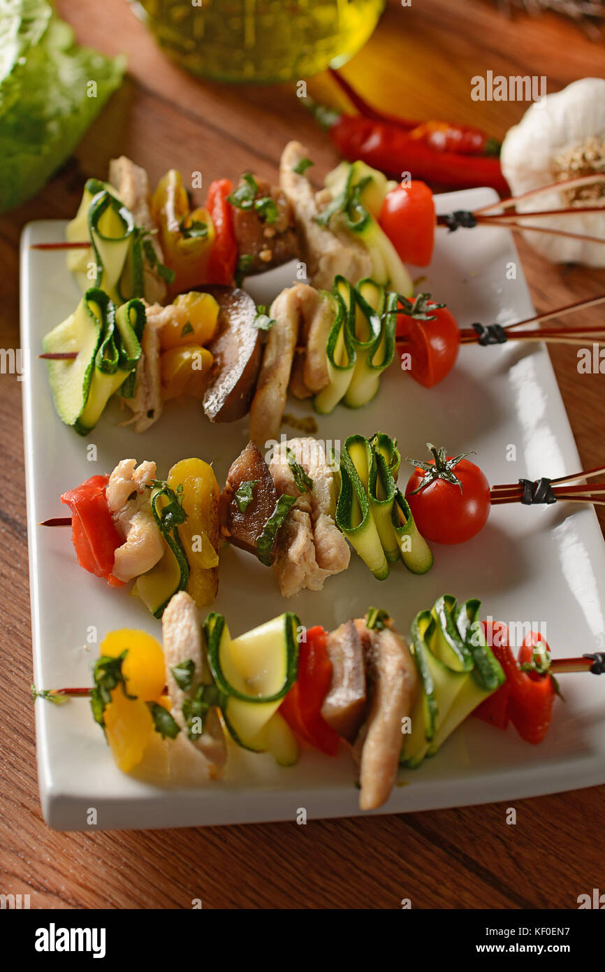 Chicken skewers with assorted vegetables - closeup Stock Photo - Alamy