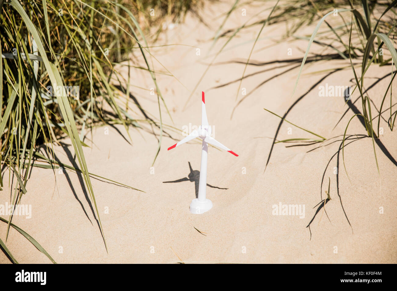 Model wind turbine on the beach in dunes Stock Photo - Alamy
