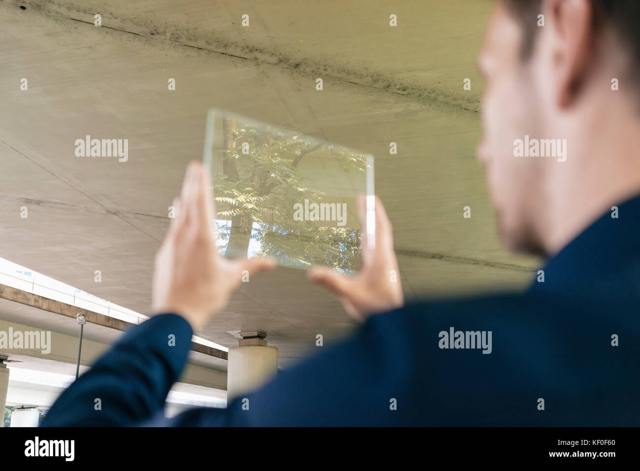 Businessman using portable glass device Stock Photo - Alamy