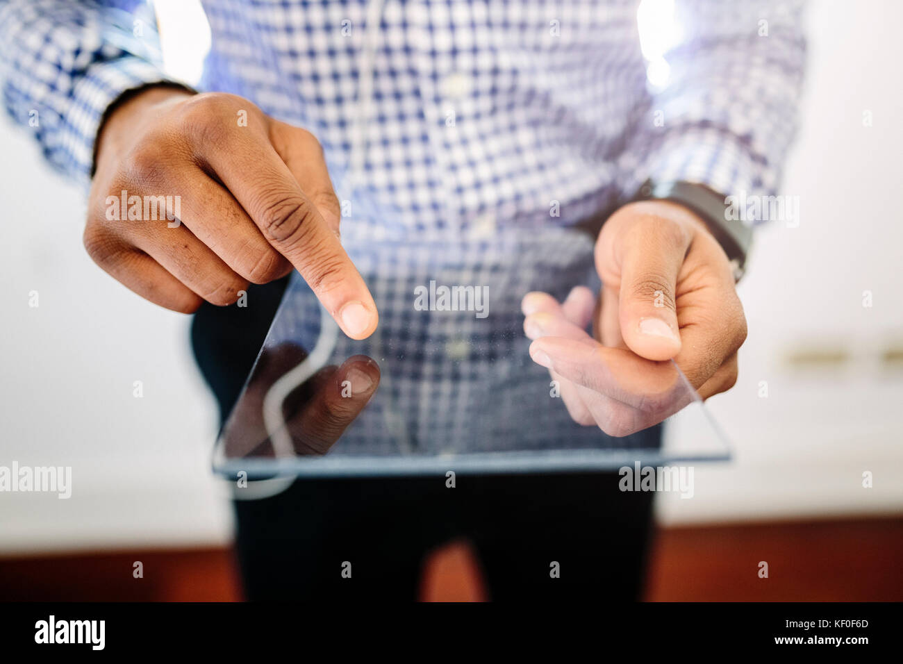 Close-up of man using a futuristic tablet Stock Photo - Alamy