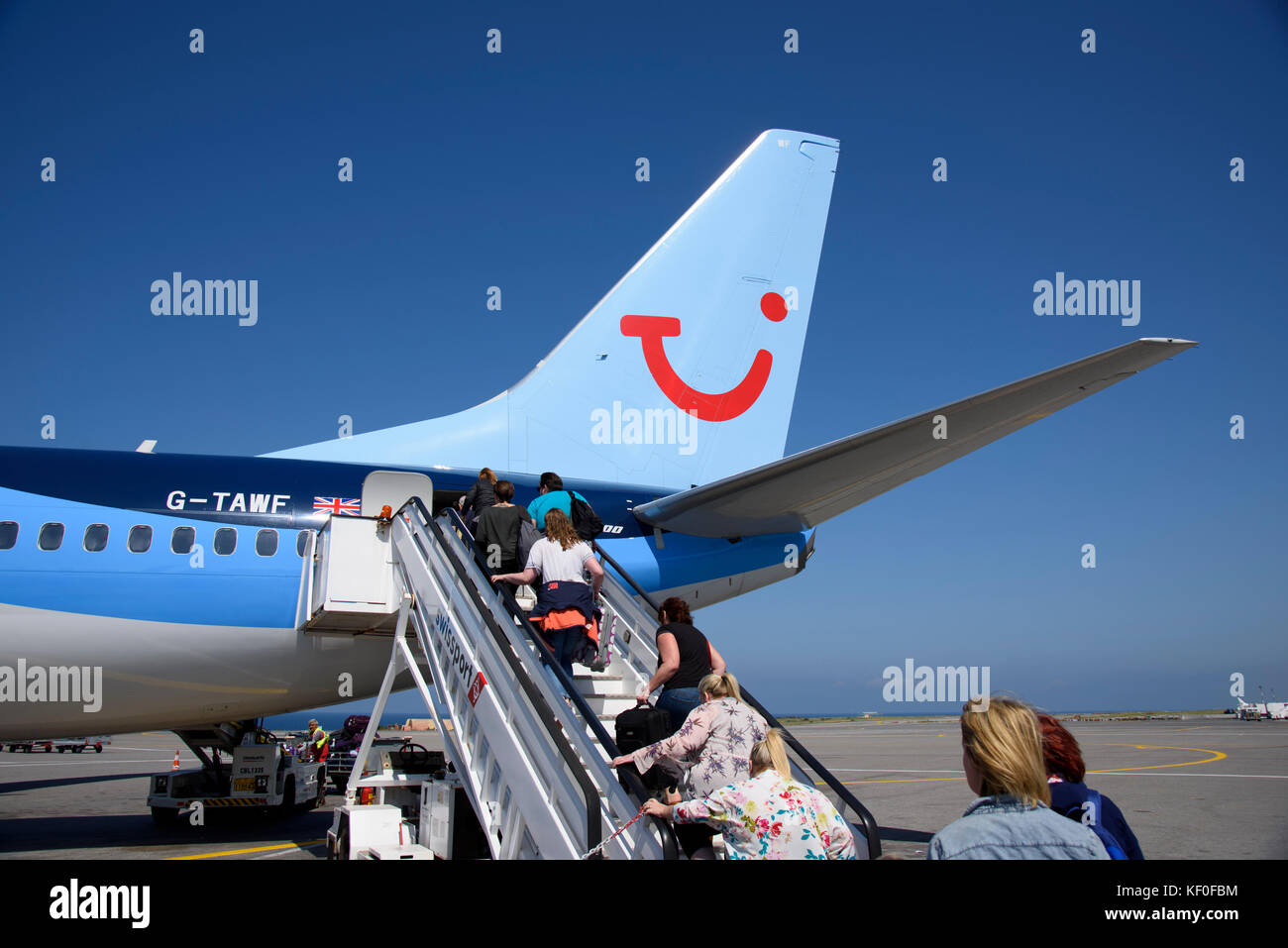 Passengers boarding a Boeing 737-800 airplane at Heraklion Airport ...