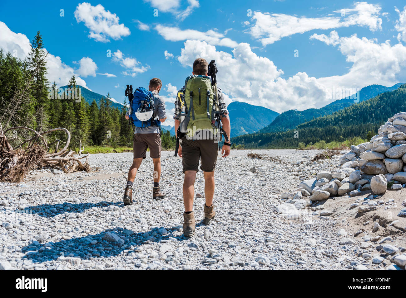 Back view of two hikers walking in dry creek bed hi-res stock ...