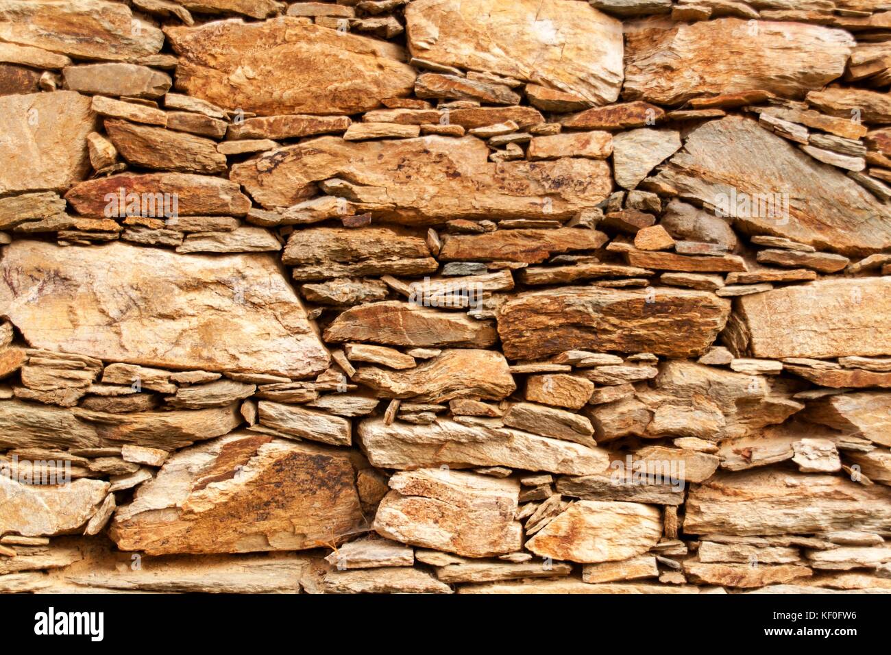 A close-up view of an old stone wall. Desktop background Stock Photo ...