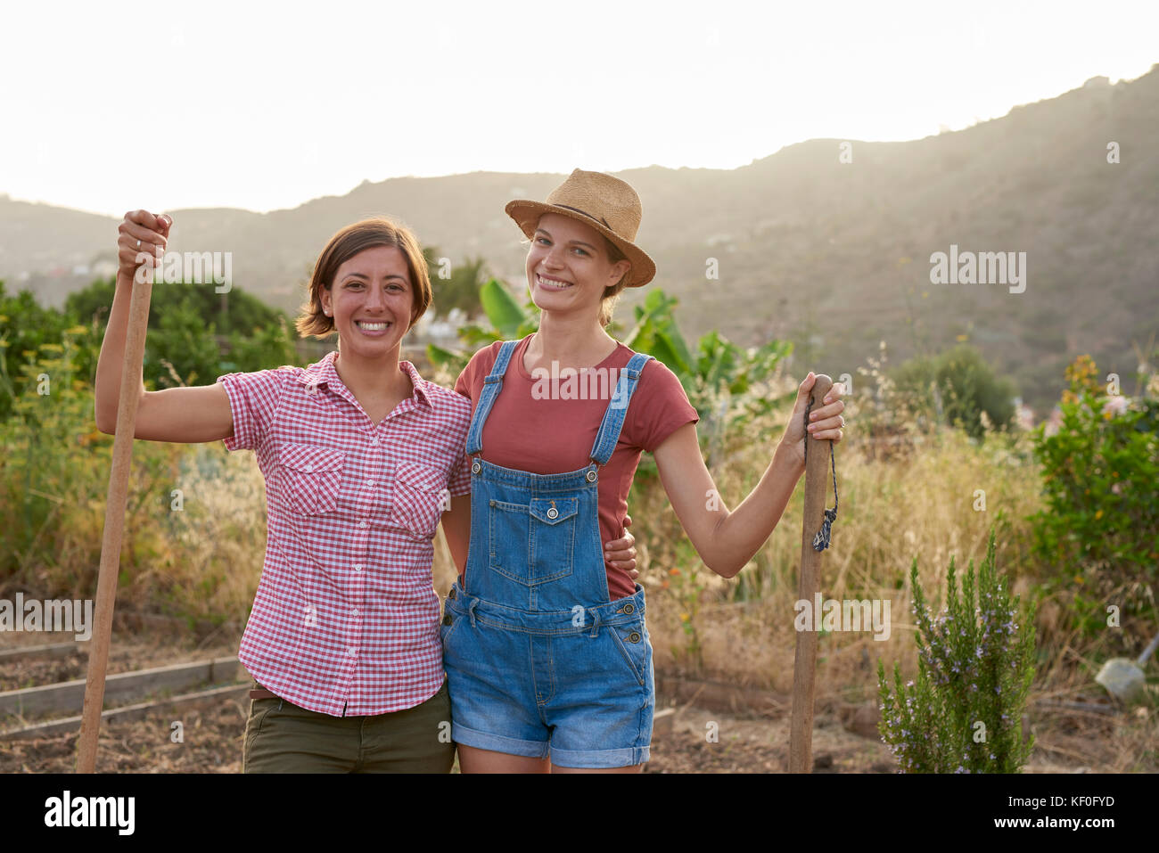 Portrait of two happy farmers with shovels Stock Photo - Alamy