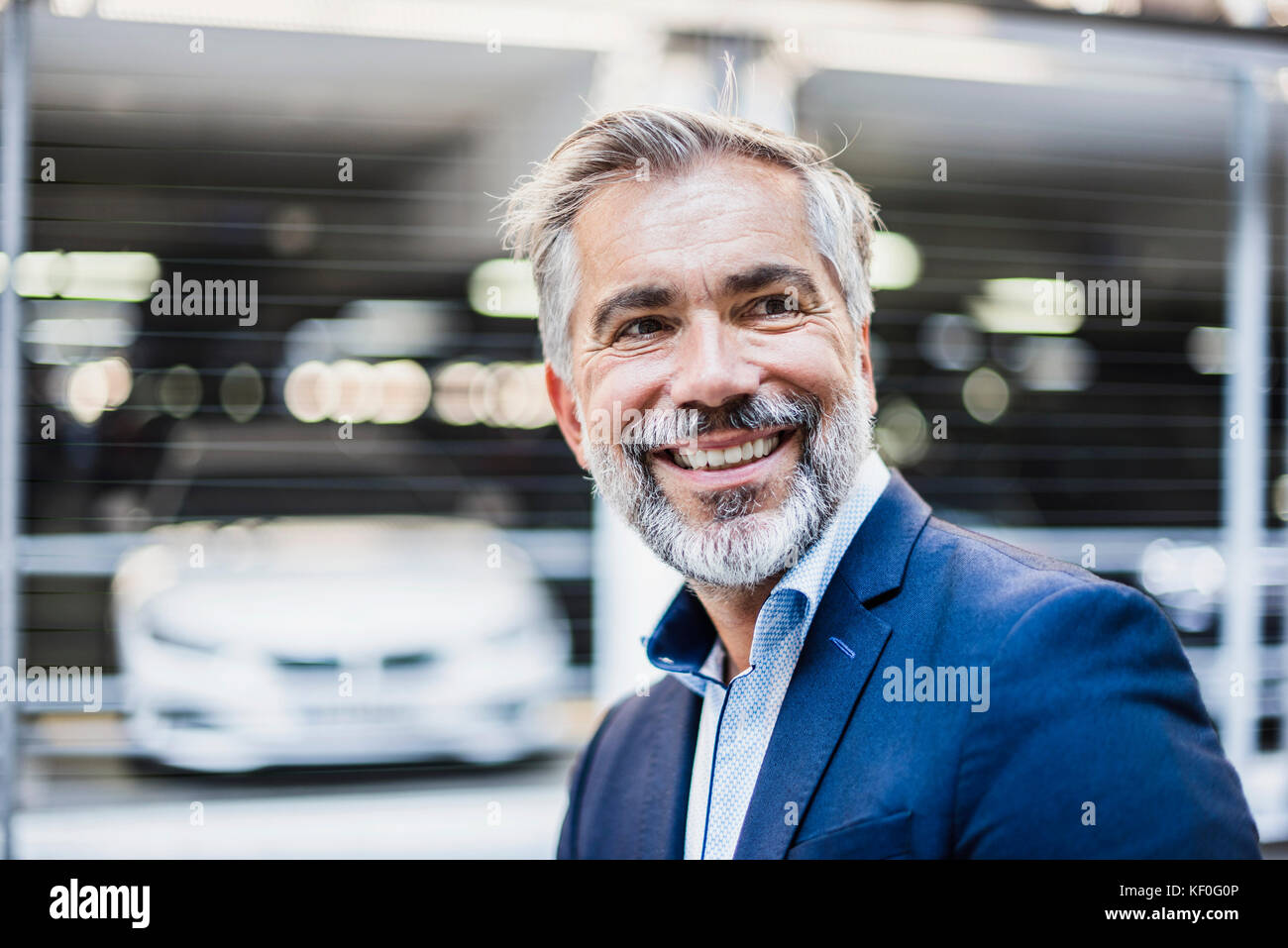 Portrait of smiling businessman Stock Photo - Alamy