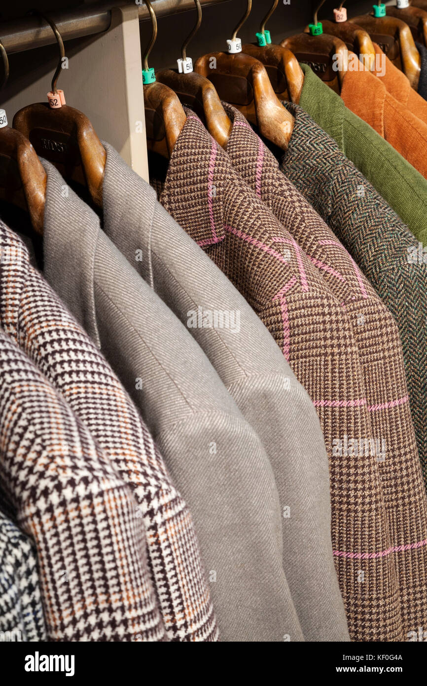 Series of man's jackets on hangers Stock Photo - Alamy