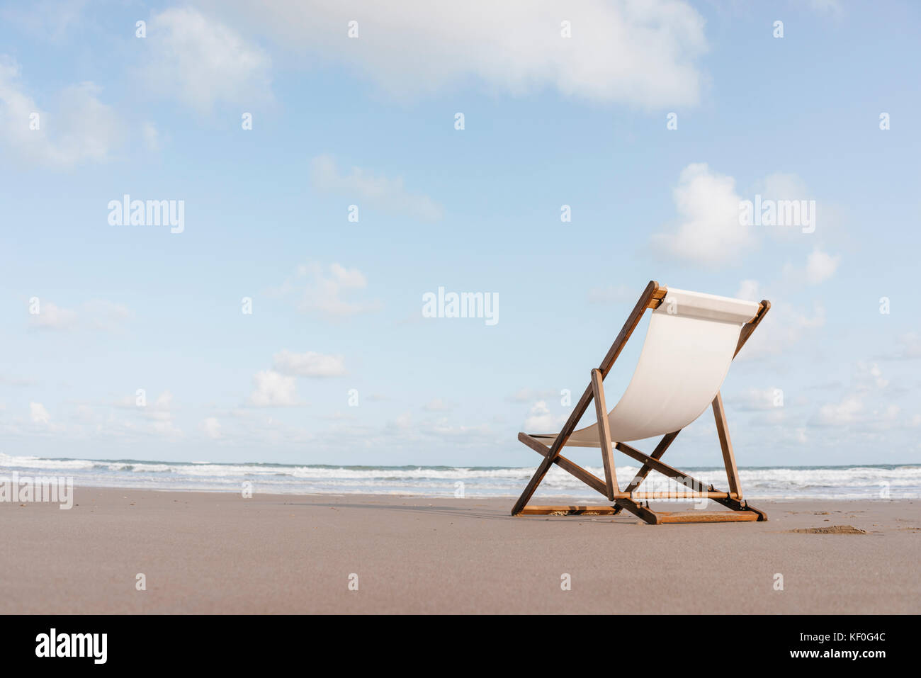 Deckchair on the beach Stock Photo - Alamy