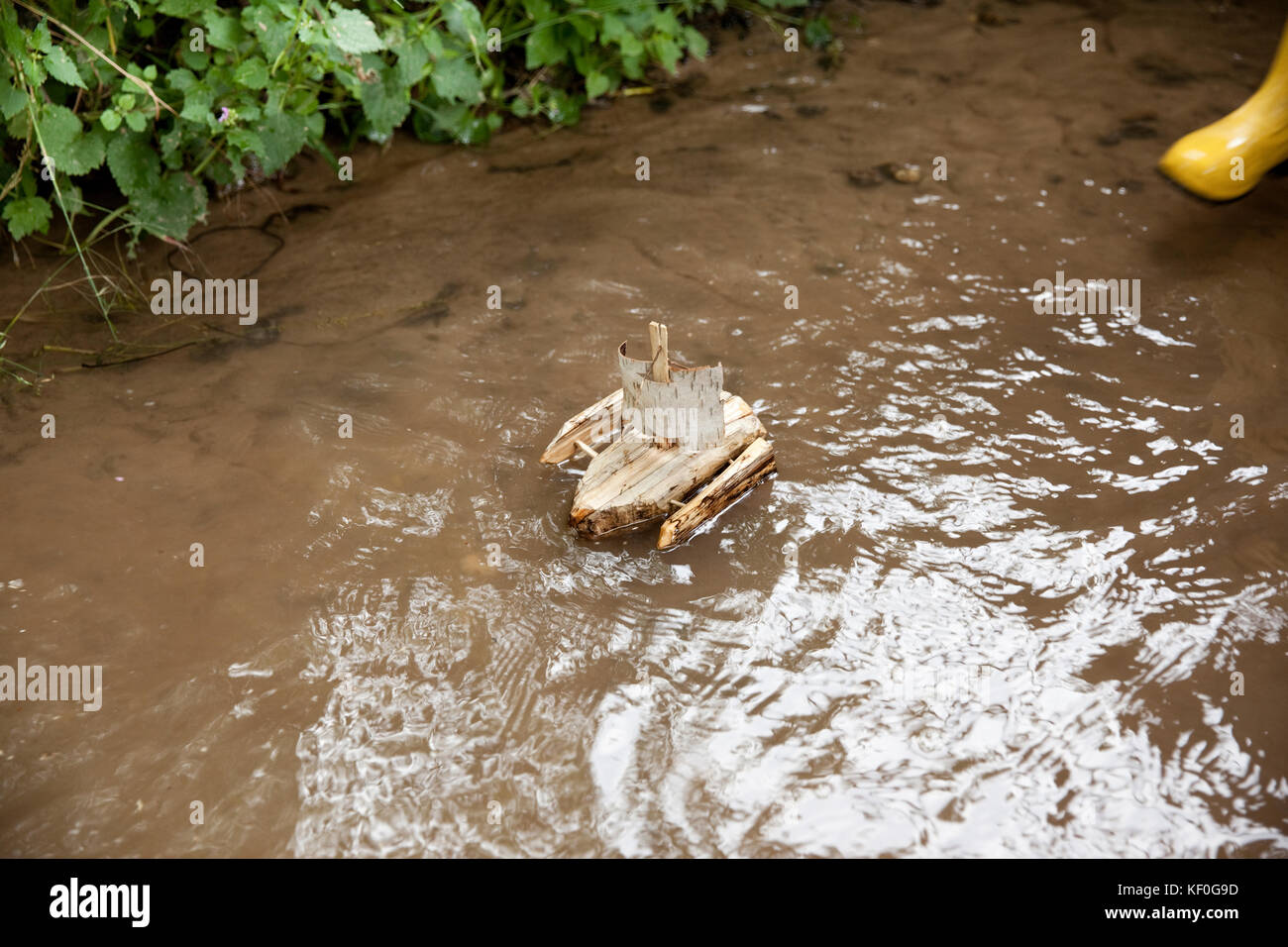 Carved wooden boat in brook Stock Photo - Alamy