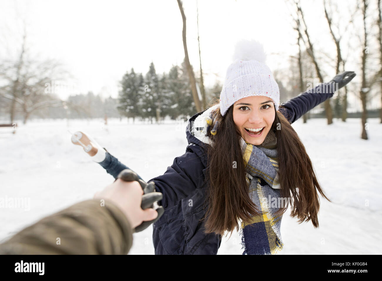 Woman having fun ice skating Stock Photo - Alamy