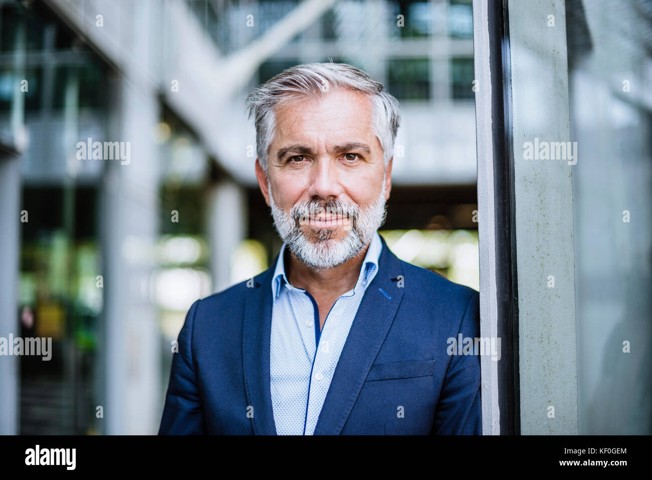 Portrait of confident businessman Stock Photo - Alamy