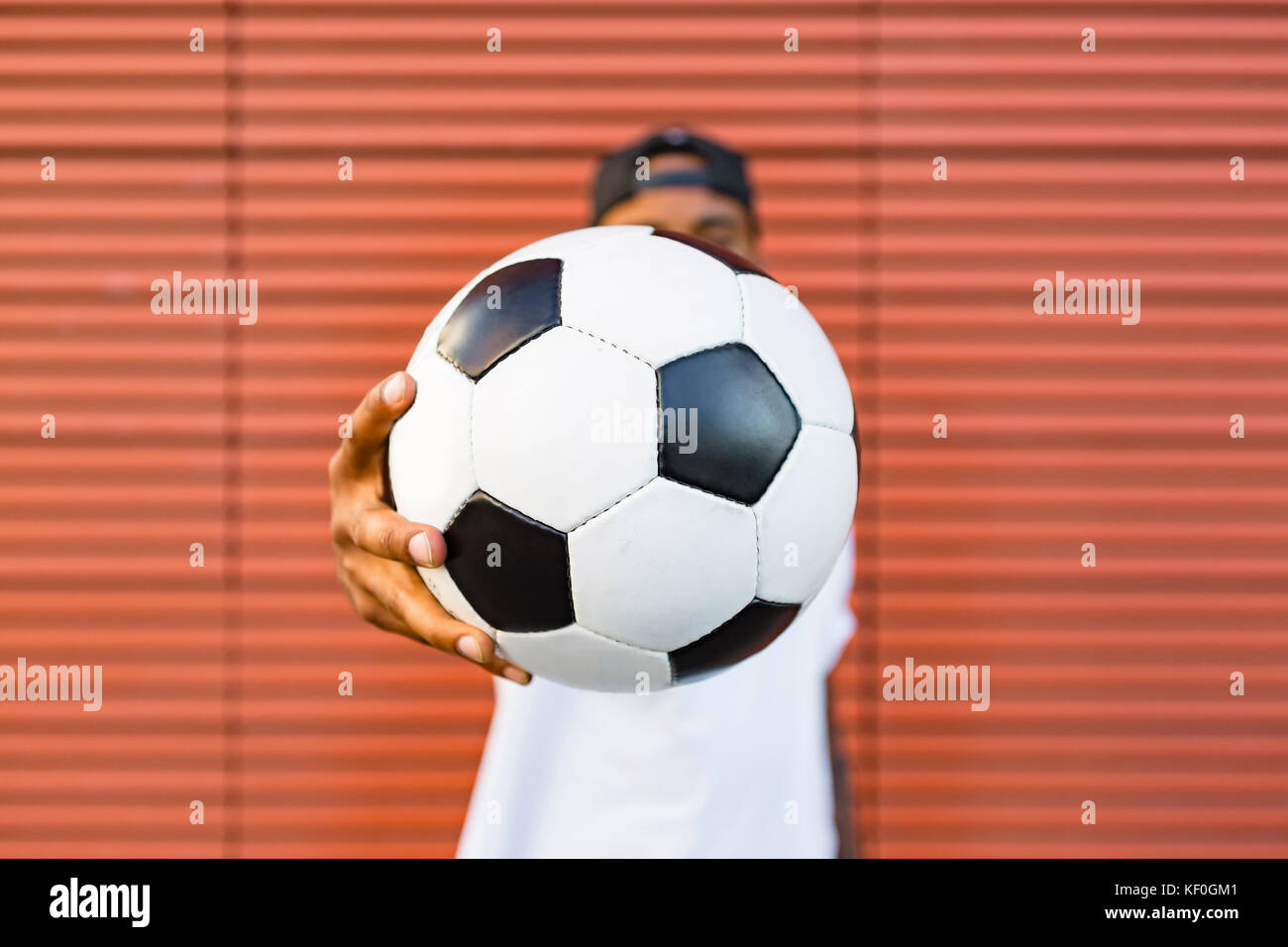 Mans hand holding soccer hi-res stock photography and images - Alamy
