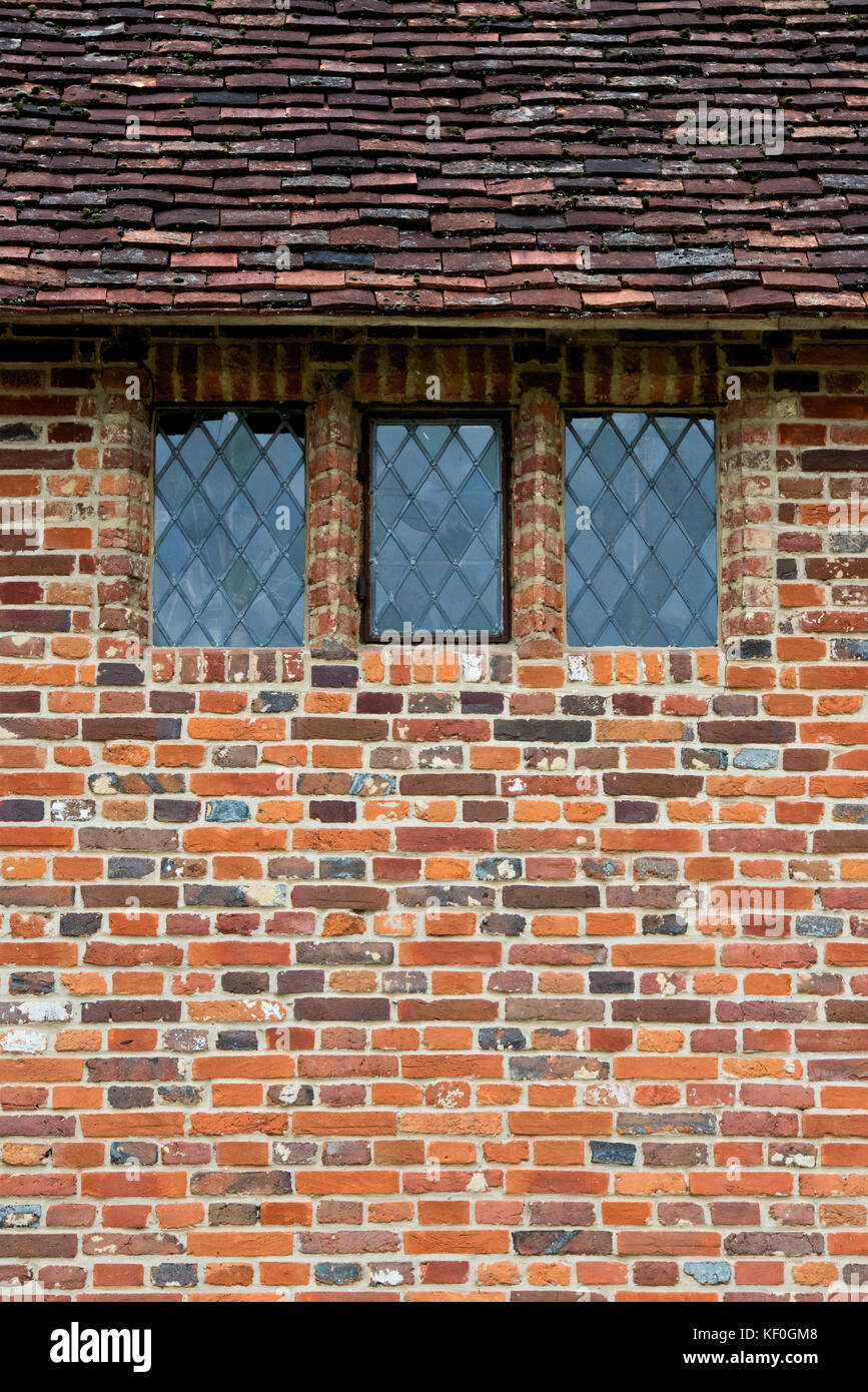 Red brick house with leaded diamond windows detail at Weald and ...