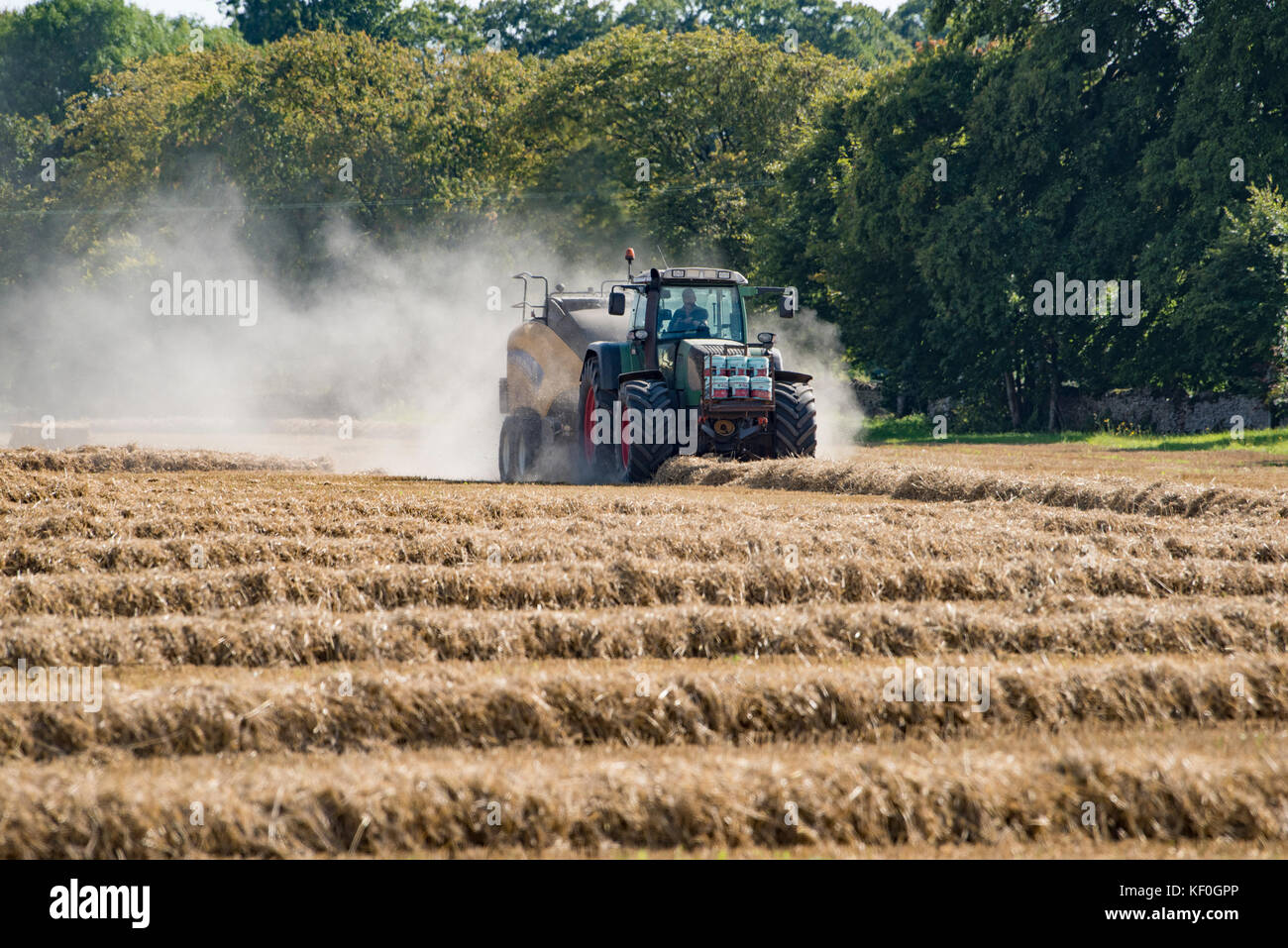 Baling wheat straw, Chedwoth, Gloucestershire Stock Photo - Alamy