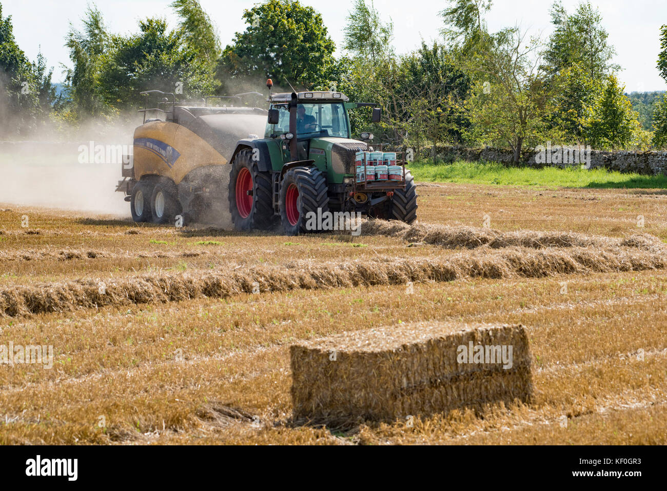 Baling wheat straw, Chedwoth, Gloucestershire Stock Photo - Alamy