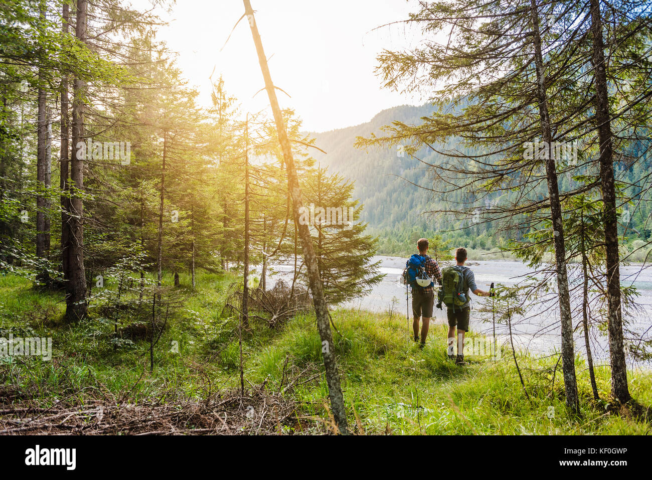 Germany, Bavaria, back view of two hikers with backpacks Stock Photo ...