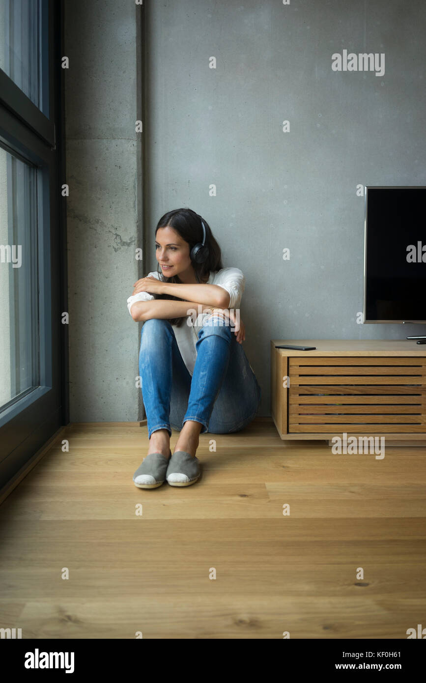 Relaxed woman listening to music at home Stock Photo - Alamy